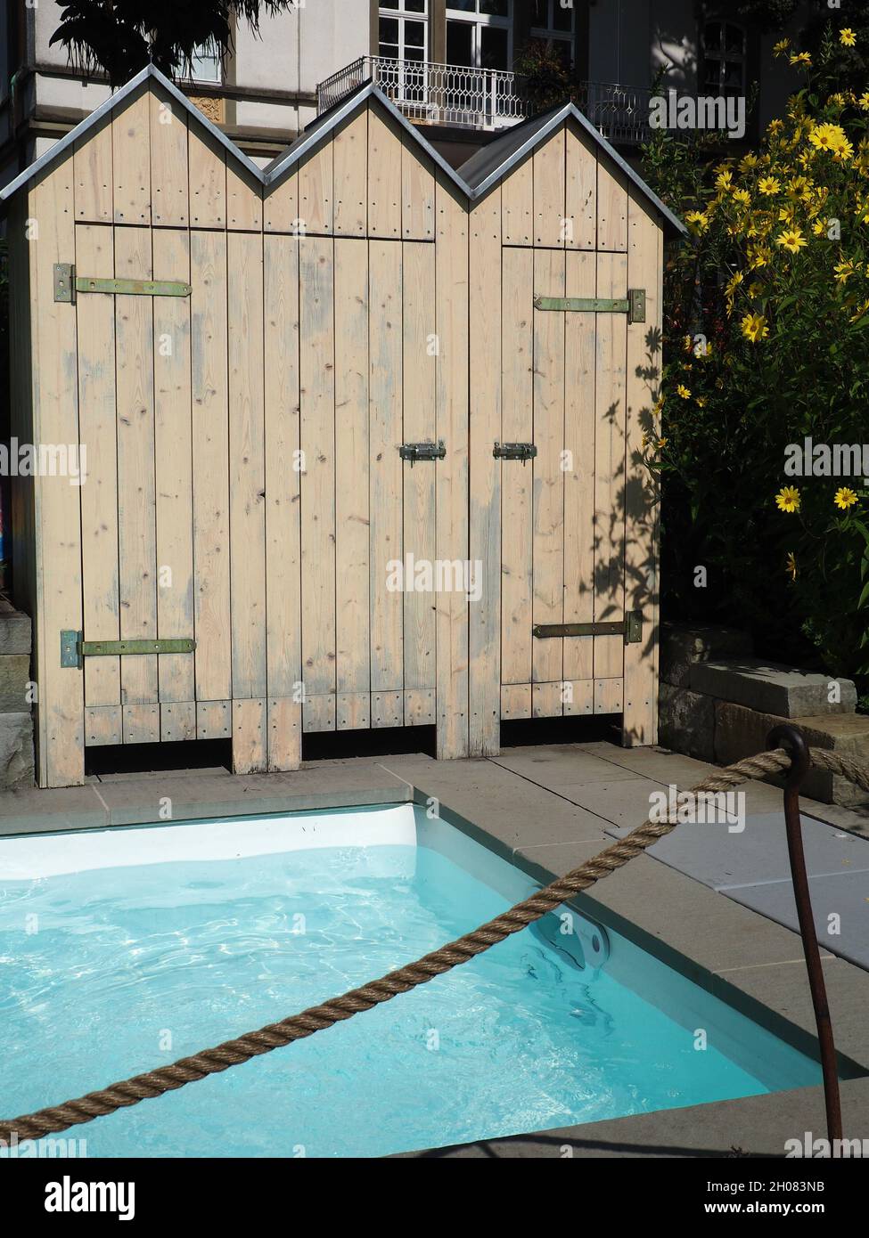 Wooden changing rooms near the swimming pool Stock Photo - Alamy