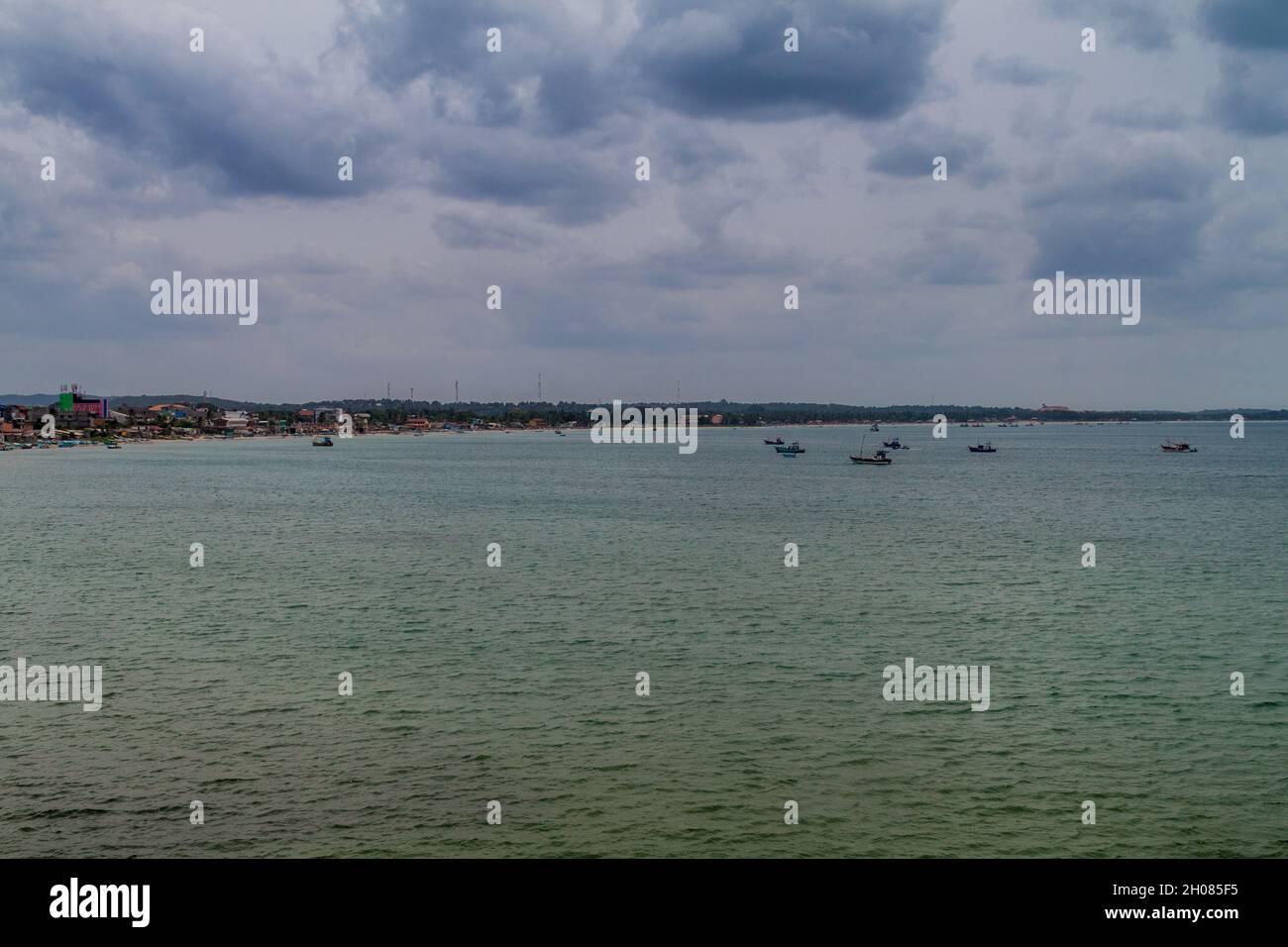 Boats on a sea coast in Trincomalee, Sri Lanka Stock Photo - Alamy