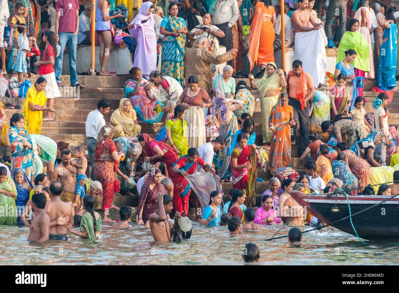 Bathers and worshippers on the banks of the Ganges River Stock Photo ...
