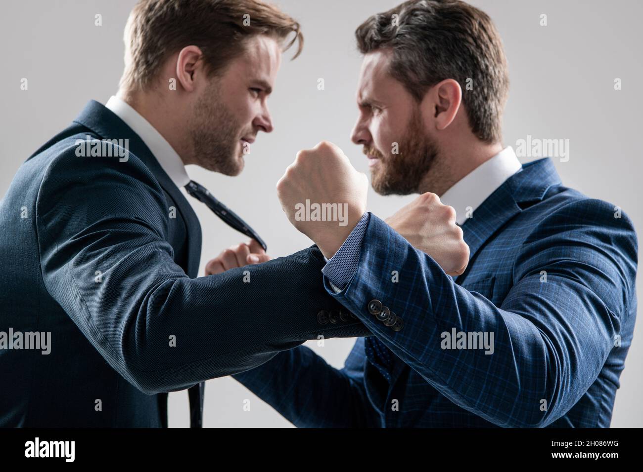 fist punching selective focus. aggressive negotiations. businessmen ...