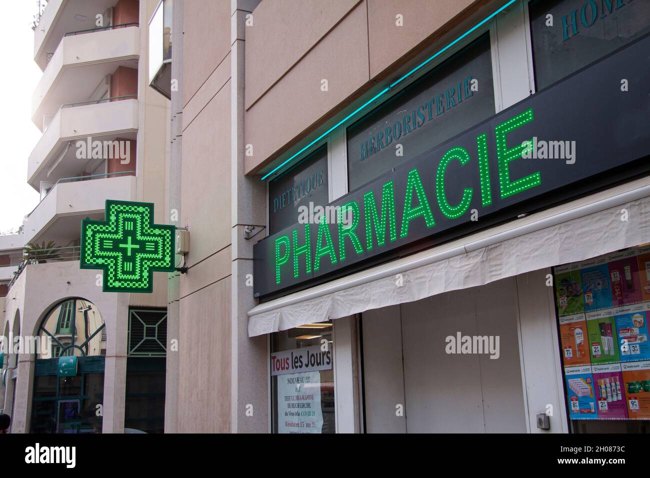 French pharmacy drug store with neon green signage - Pharmacie - on ...