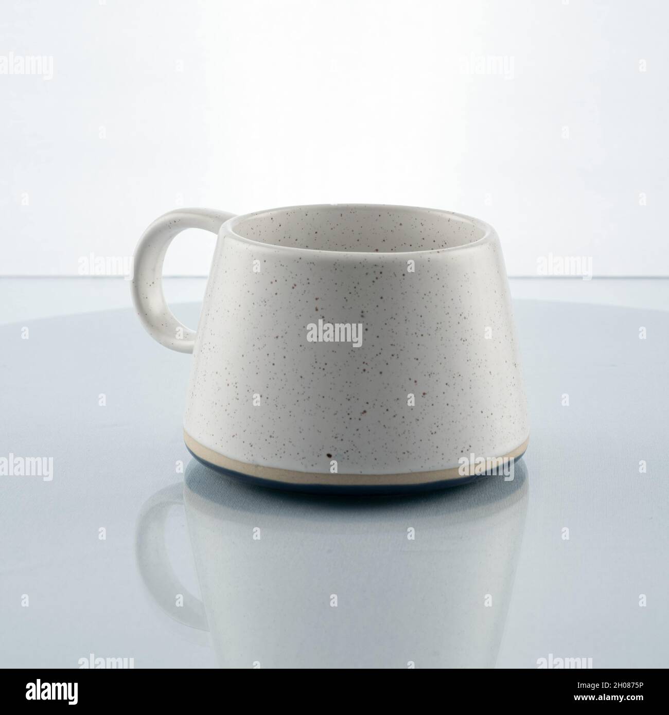 Matte white mug for casual breakfast on a white background and glass ...