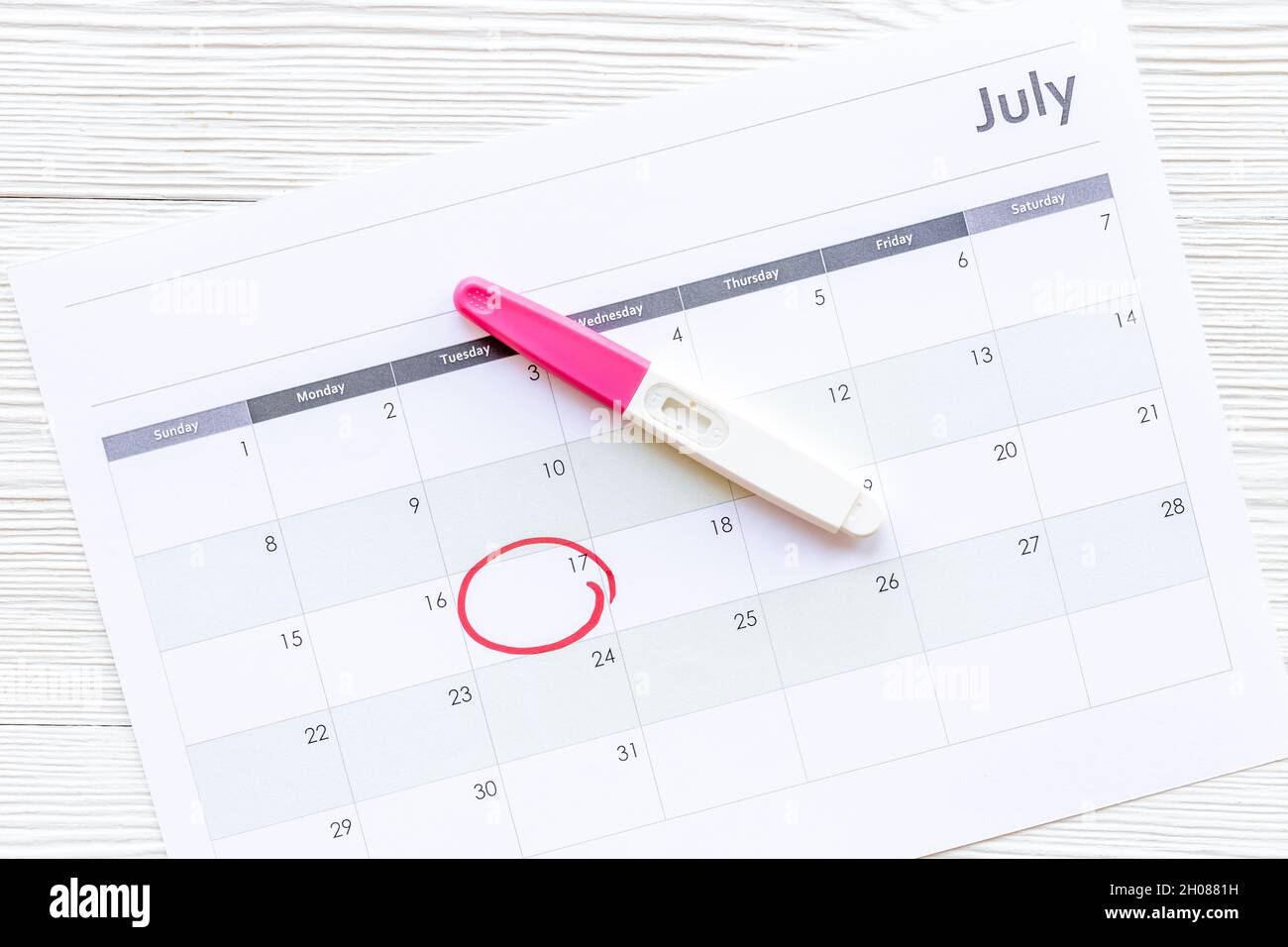 Pregnancy test with calendar to check pregnancy day Stock Photo - Alamy