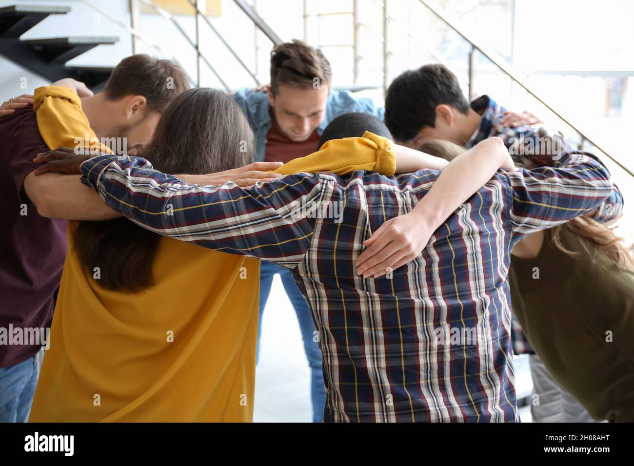 People standing together in circle indoors. Unity concept Stock Photo ...