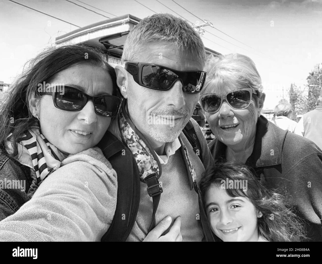 Beautiful grayscale Caucasian family selfie during their vacation Stock ...