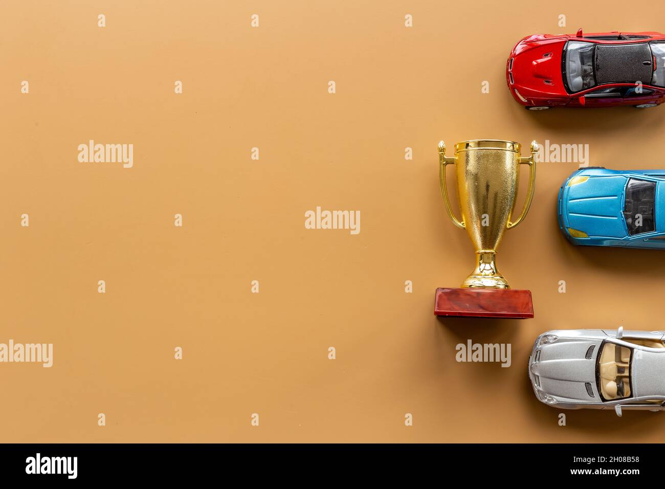 Golden trophy cup with car models. Rally champion winner concept Stock ...
