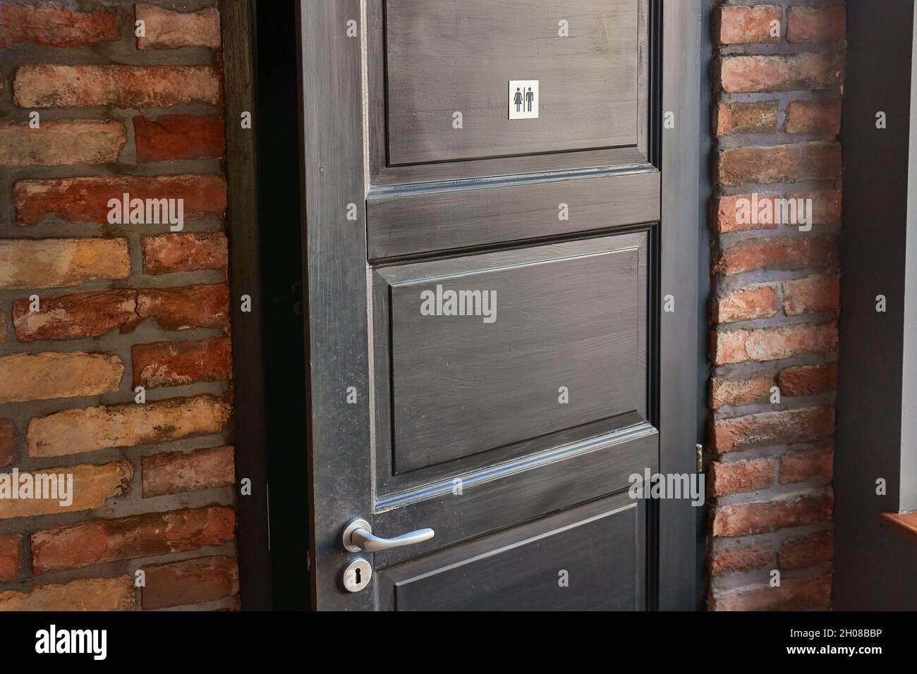 Toilet door left ajar Stock Photo - Alamy