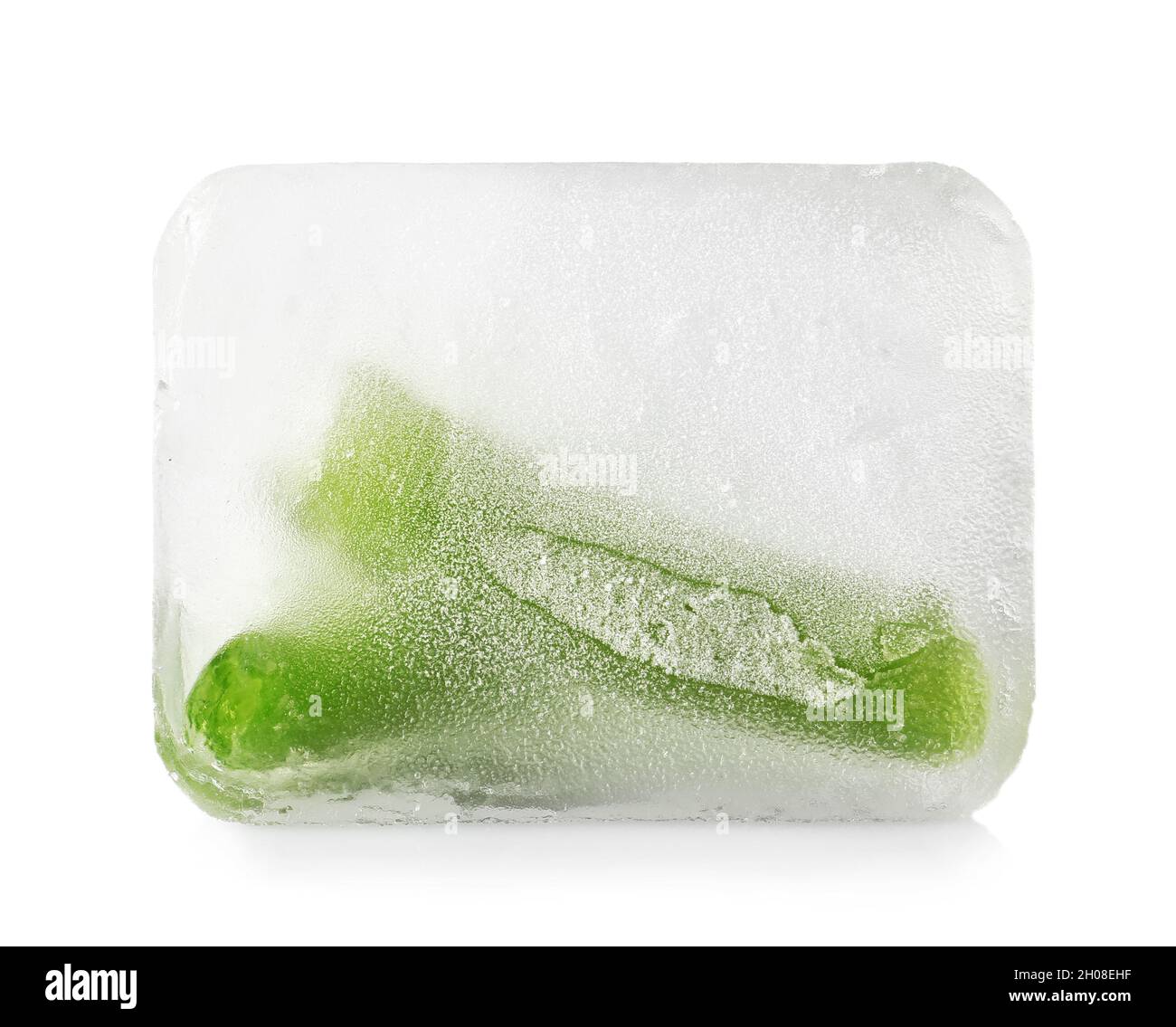 Fresh green beans in ice cube on white background. Frozen vegetables ...
