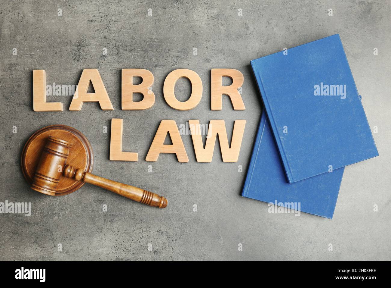 Flat lay composition with words LABOR LAW on grey background Stock ...