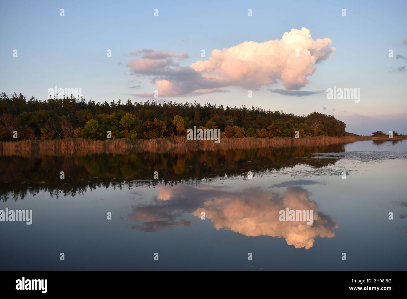 Atmospheric and colorful landscape of clouds in the lake Stock Photo ...