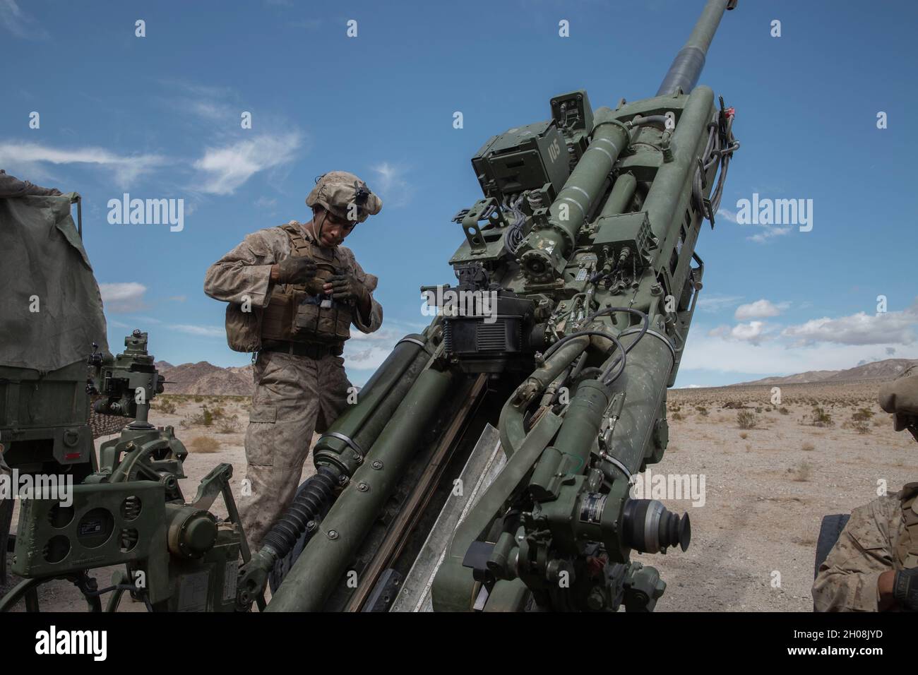U.S. Marine Corps Cpl. Bryan Luzon, a field artillery cannoneer with ...
