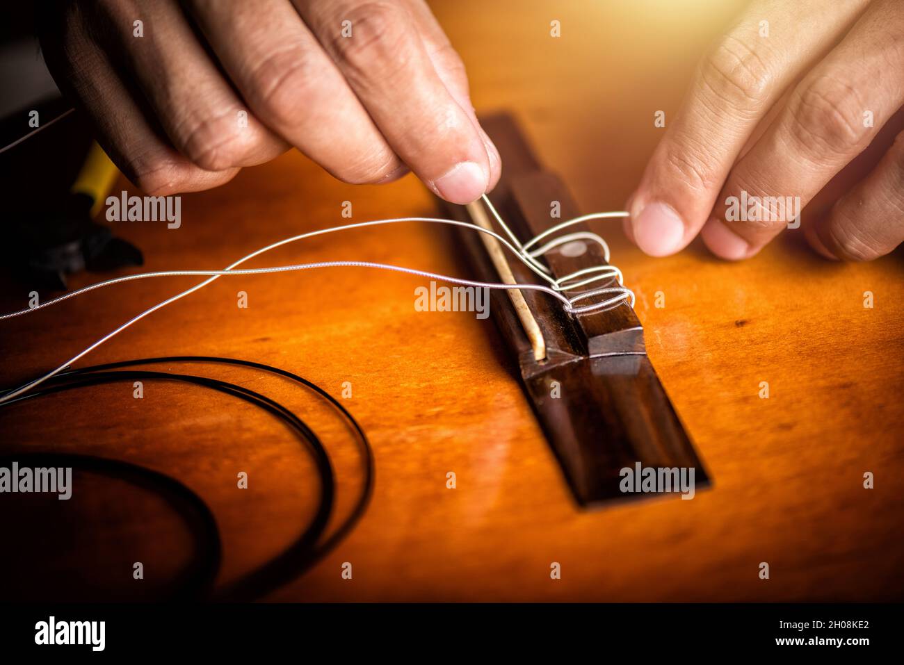 Restring acoustic guitar hi-res stock photography and images - Alamy