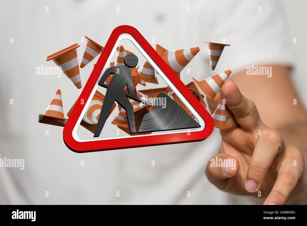 Human hand showing construction and barrier signs Stock Photo - Alamy