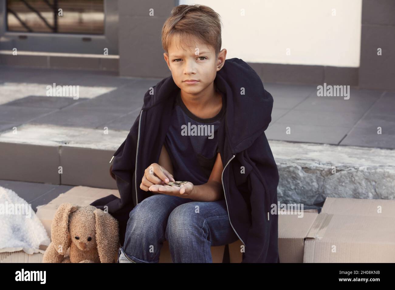 Boy Counting Coins High Resolution Stock Photography and Images - Alamy
