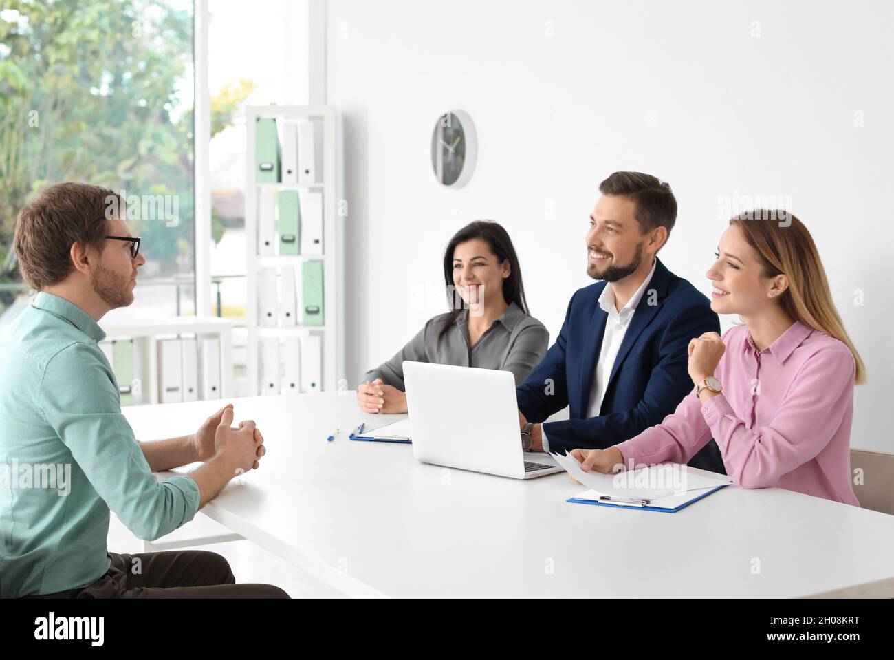 Human resources commission conducting job interview with applicant in ...