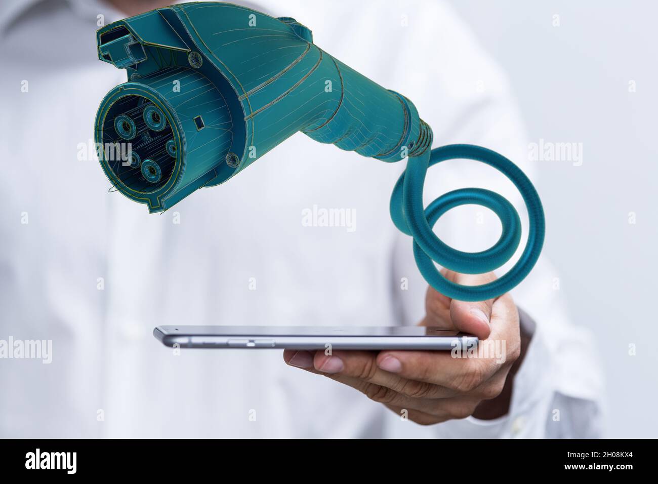 Human hand with a tablet showing cable pump plug in charging power ...