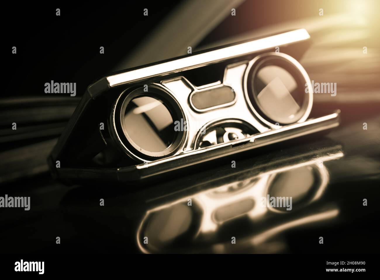 Closeup vintage folding opera glasses. Old compact binoculars Stock ...