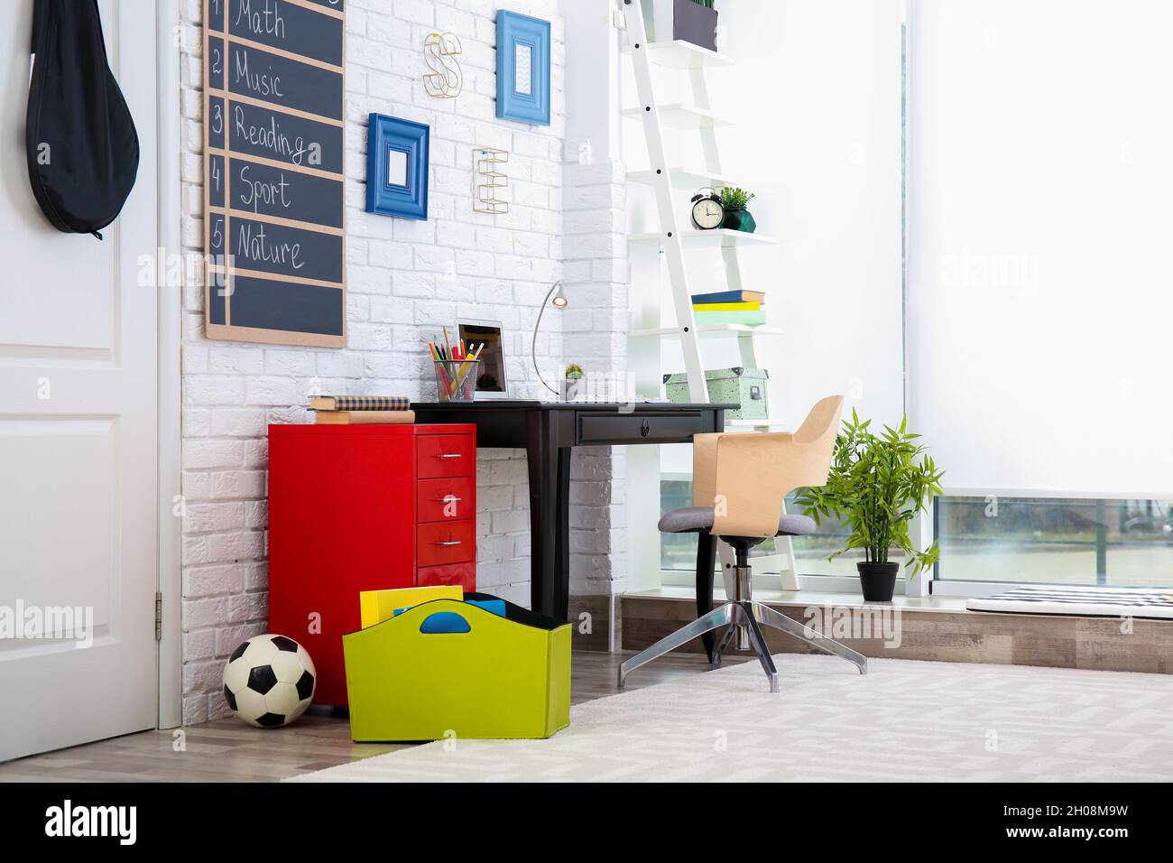 Modern child room interior with desk and laptop Stock Photo - Alamy