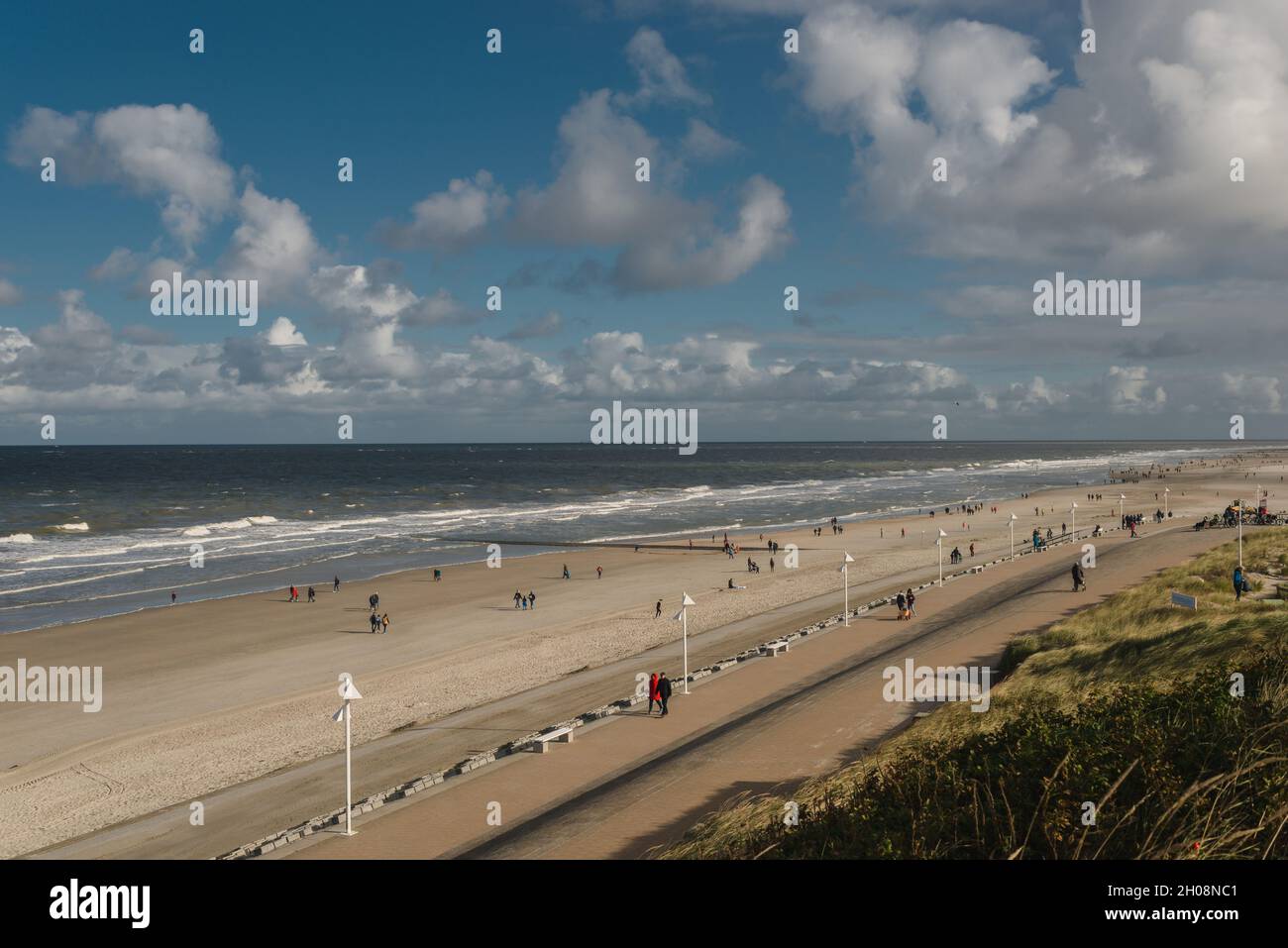 Norderney, Germany. 11th Oct, 2021. Tourists enjoy a golden October at ...