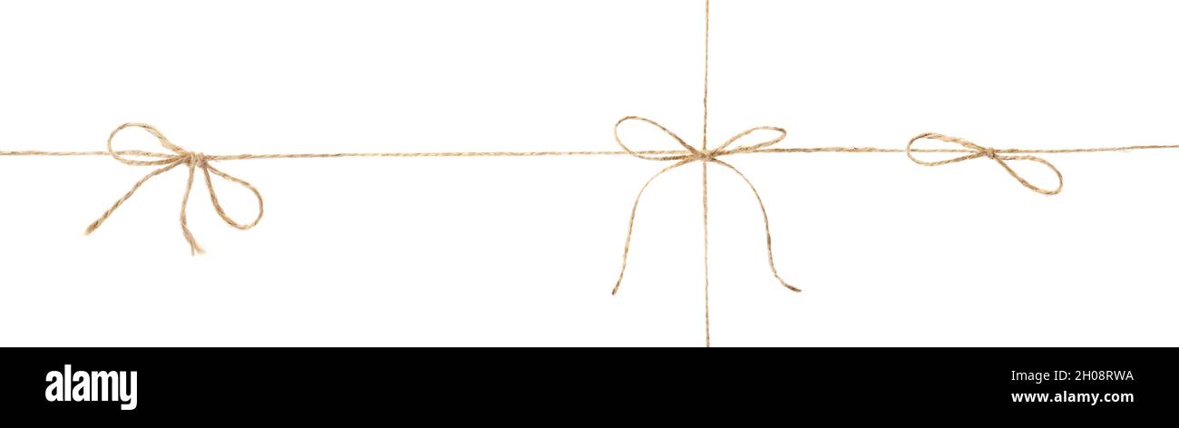 Set with hemp rope and bows on white background Stock Photo - Alamy