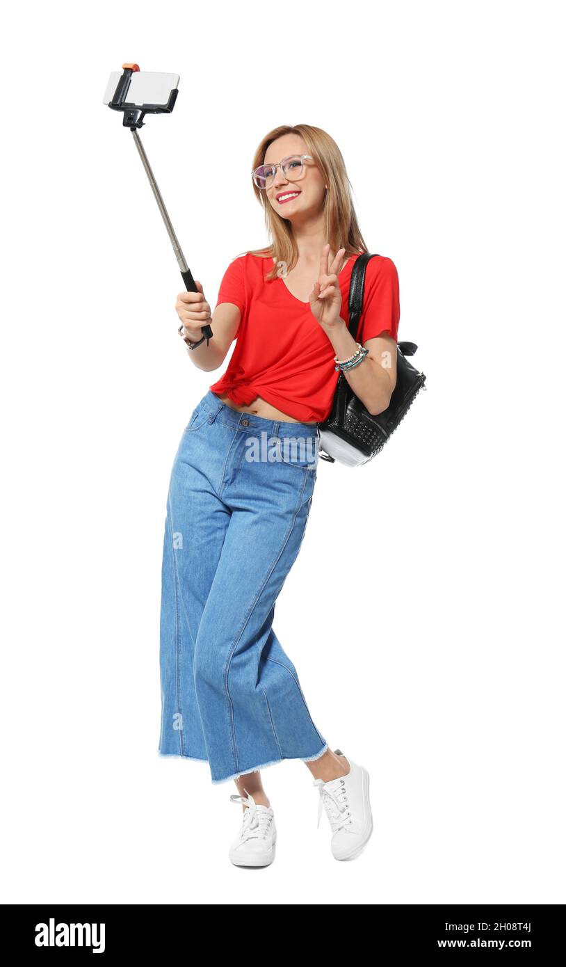 Attractive young woman taking selfie on white background Stock Photo ...