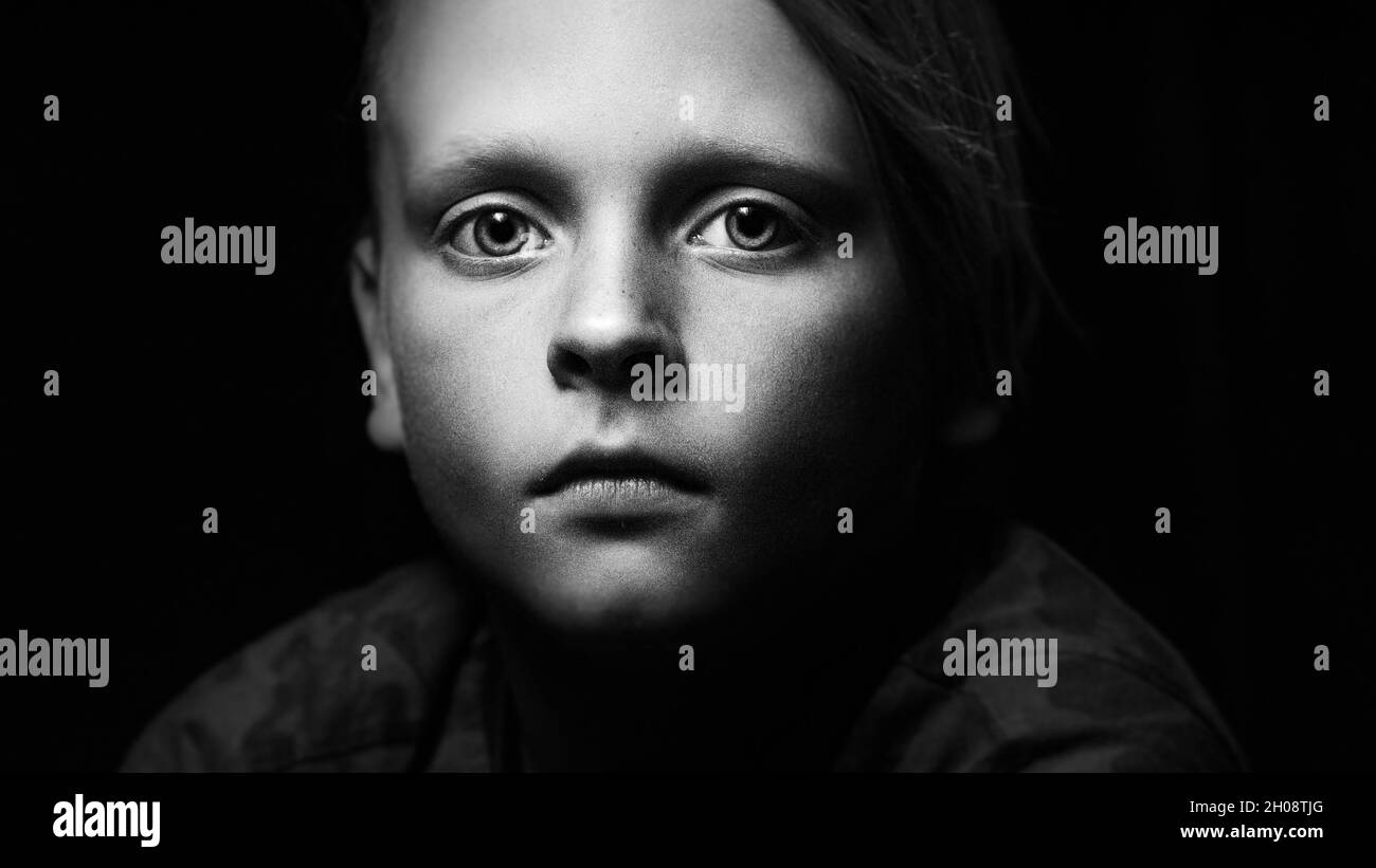 Portrait of a caucasian kid with a meaningful look in grayscale Stock ...