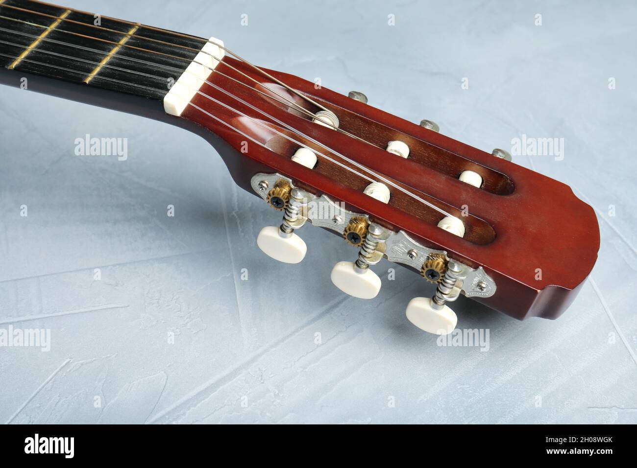 Beautiful classical guitar on color background, closeup view Stock ...