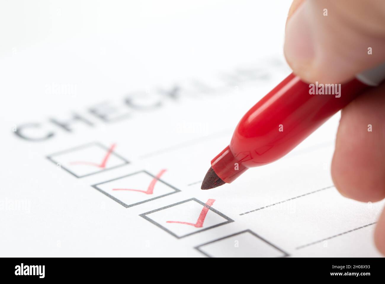 Hand with red marker pen marking on checklist box Stock Photo - Alamy