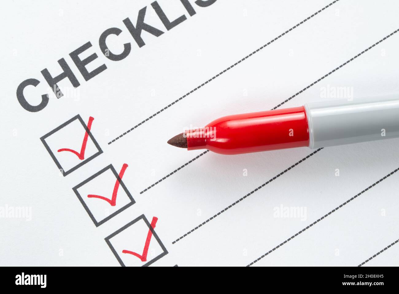 Checklist box with red marker pen Stock Photo - Alamy