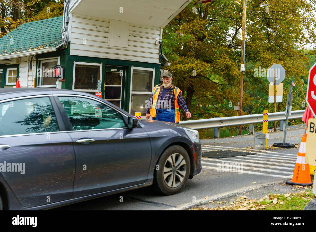 Dingmans Ferry, PA, USA - October 10, 2021: A toll collector is ready ...