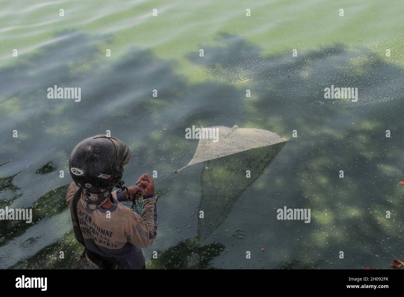 Bandung, Indonesia. 10th Oct, 2021. A man seen fishing at Cikoneng ...