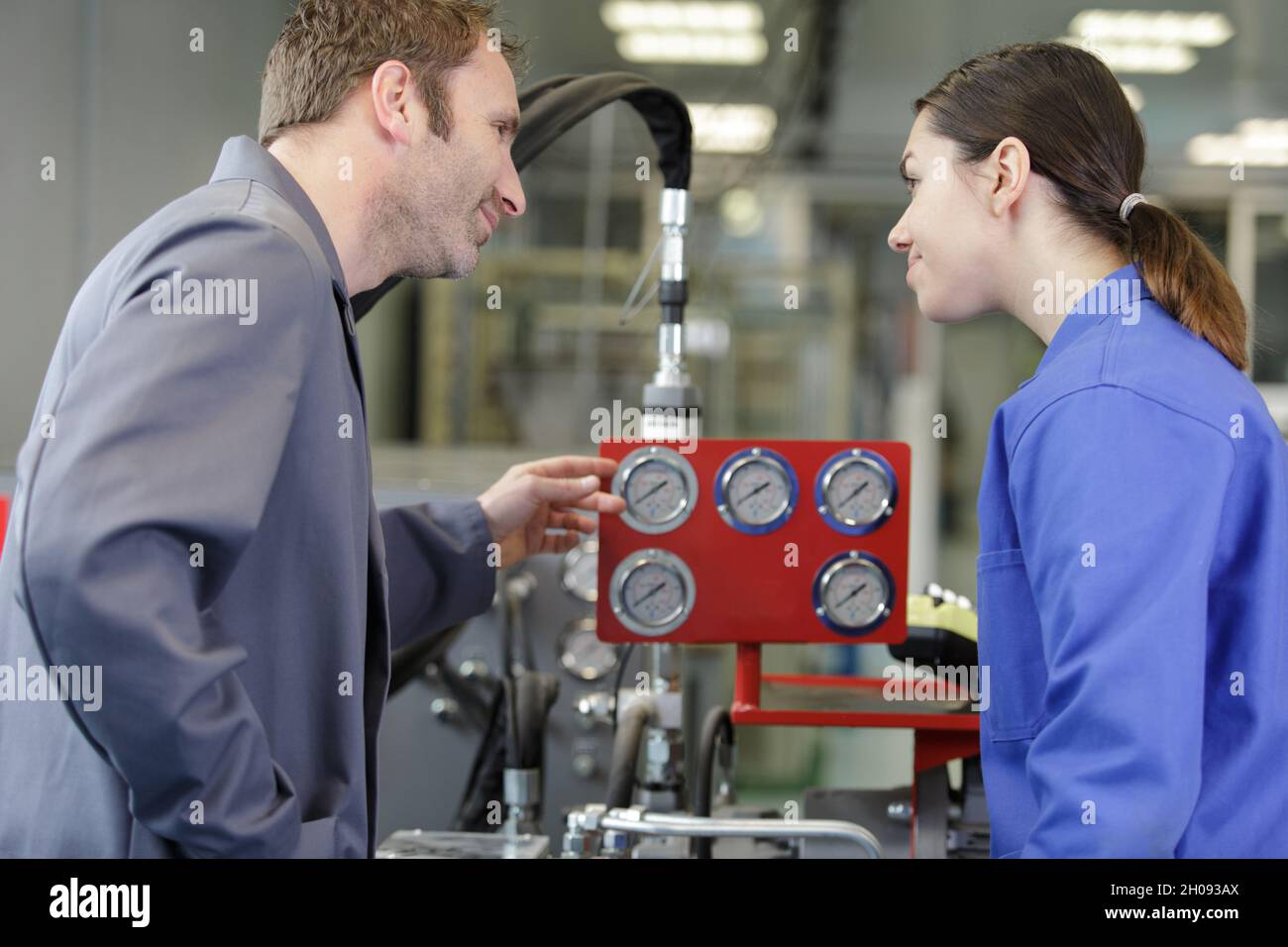 two mechanics in an industry Stock Photo - Alamy