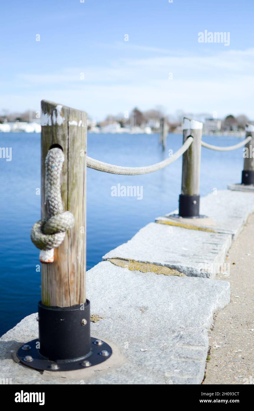 Nautical harbor posts along a walkway Stock Photo - Alamy