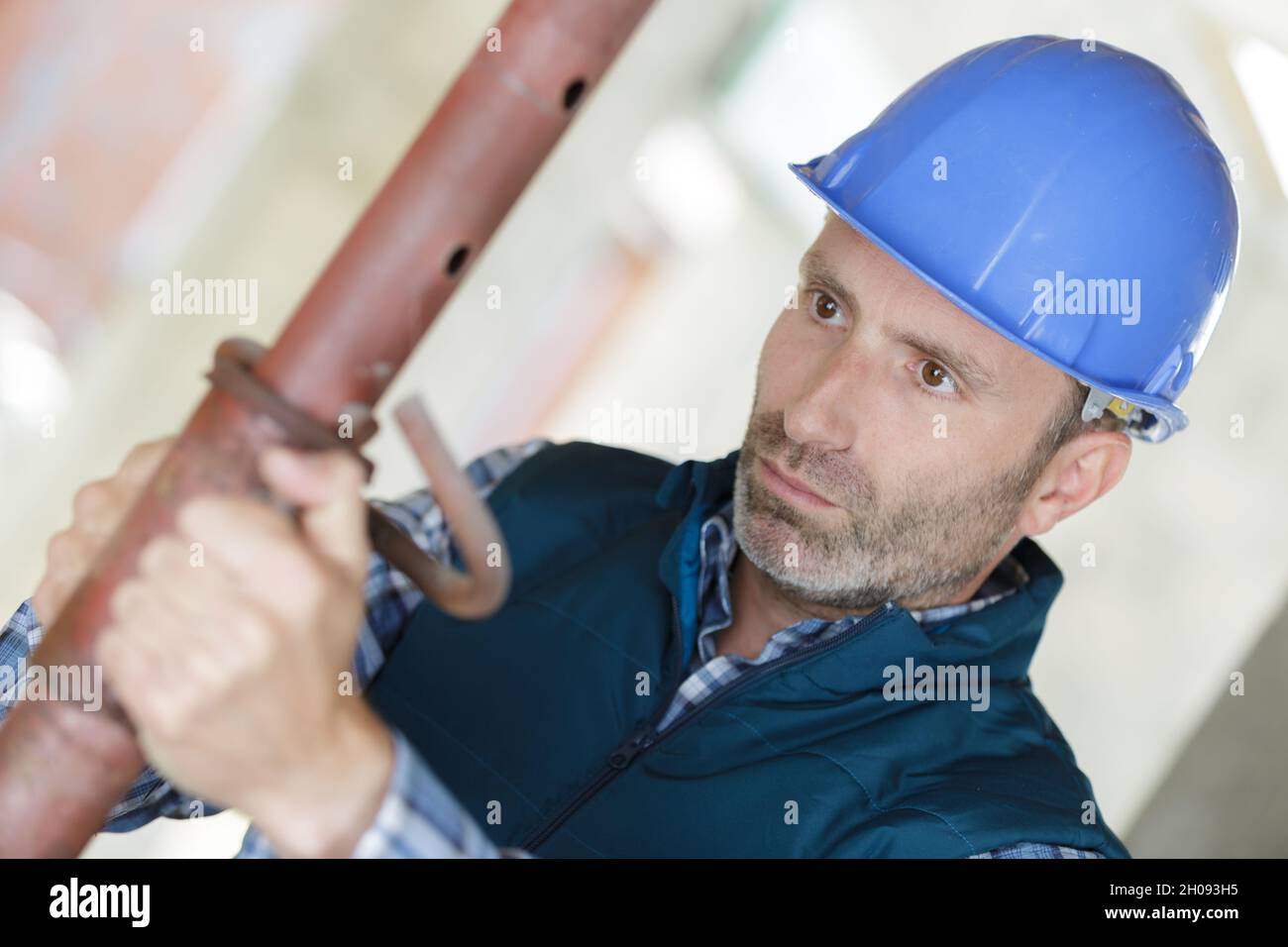 portrait of a concentrated contractor at work Stock Photo - Alamy
