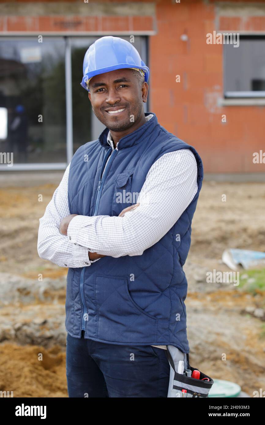a handsome constructor smiling outdoors Stock Photo - Alamy