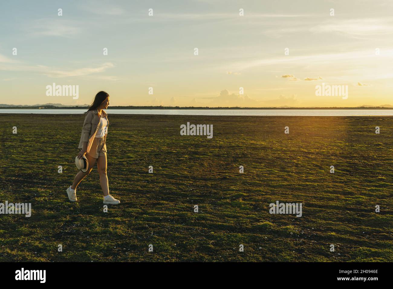Girl walking across field hi-res stock photography and images - Alamy