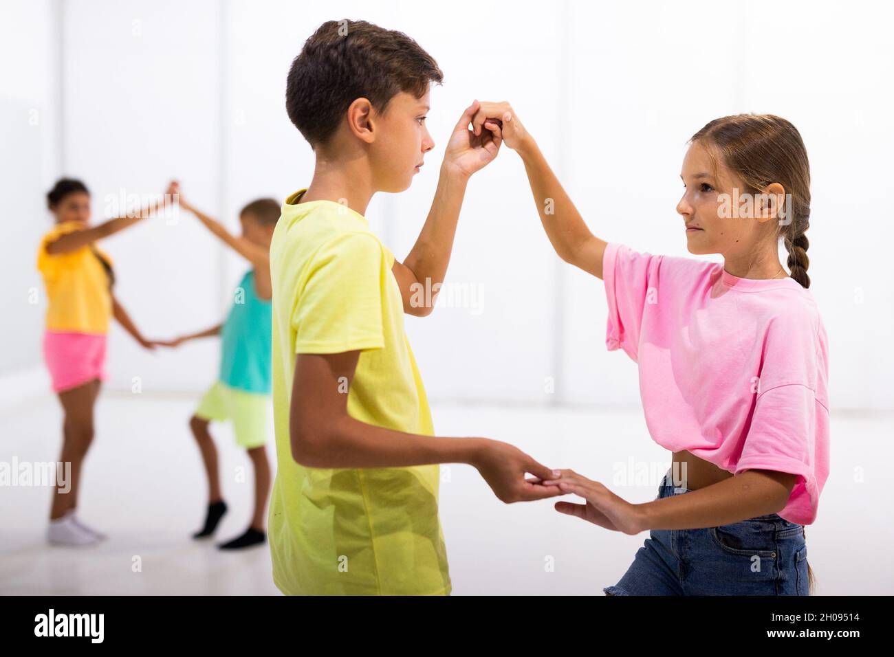 Portrait of children enjoying of partner dance in class Stock Photo - Alamy