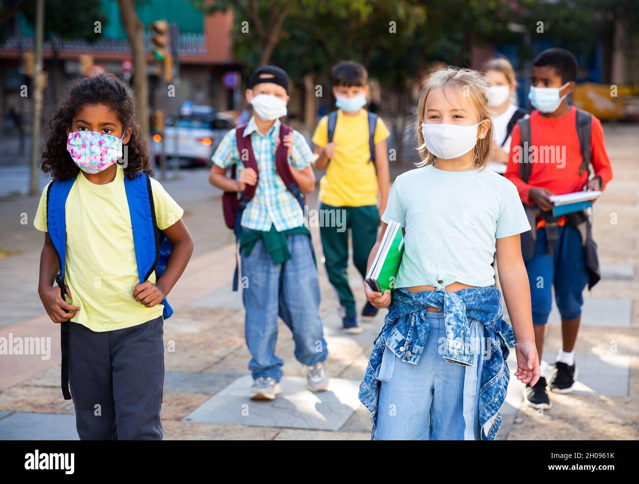 Children in masks going to school Stock Photo - Alamy