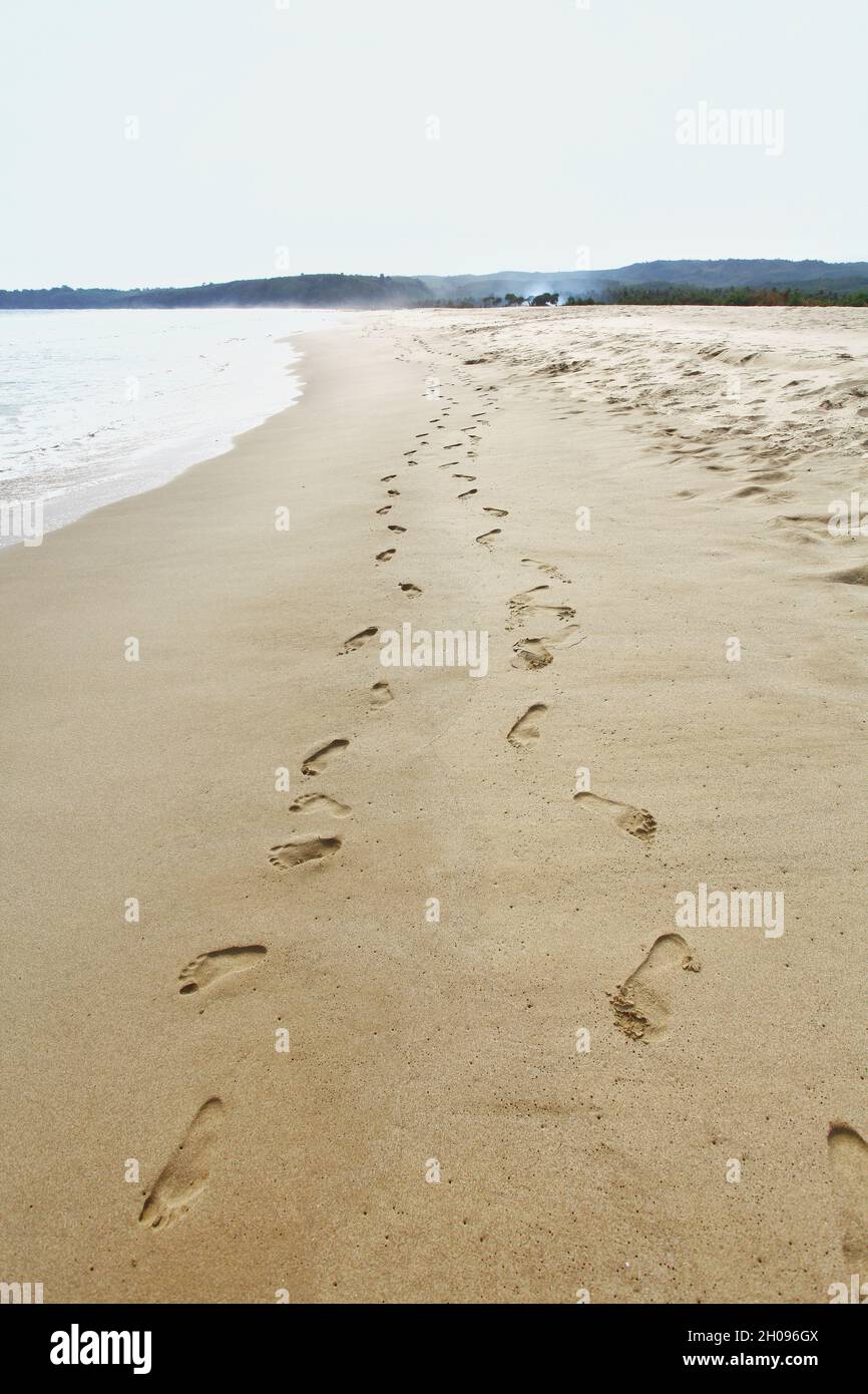 Flat sandy beach with waves Stock Photo - Alamy