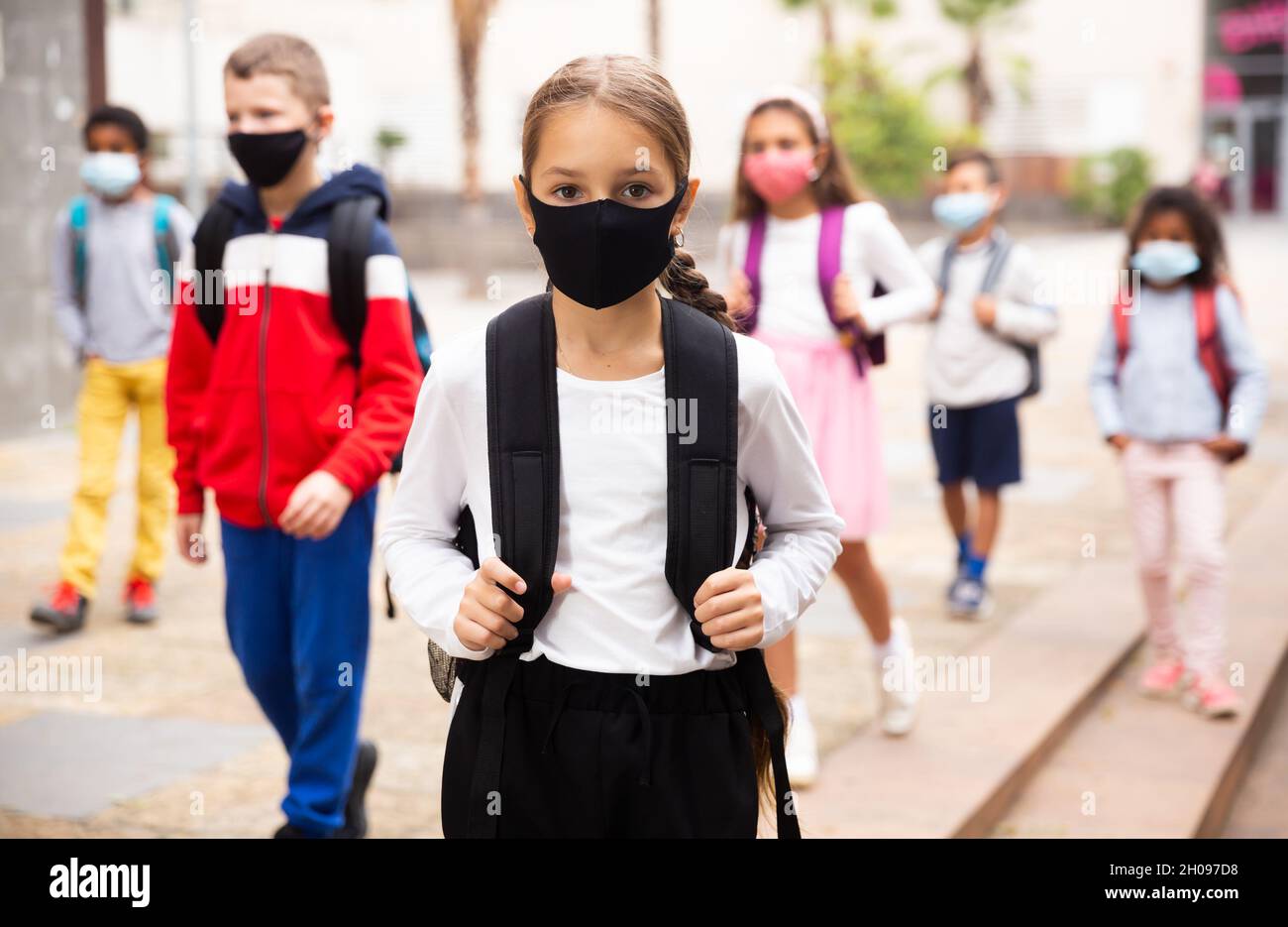 Teen girl in protective mask going to school lessons Stock Photo - Alamy