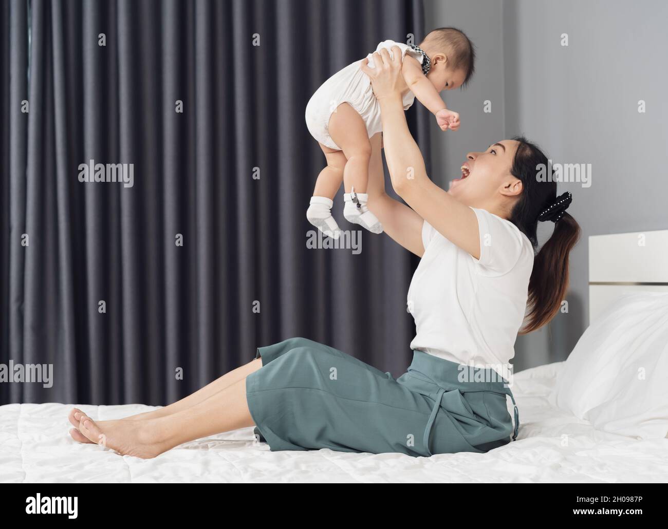 Boy lifting girl in his arms hi-res stock photography and images - Alamy