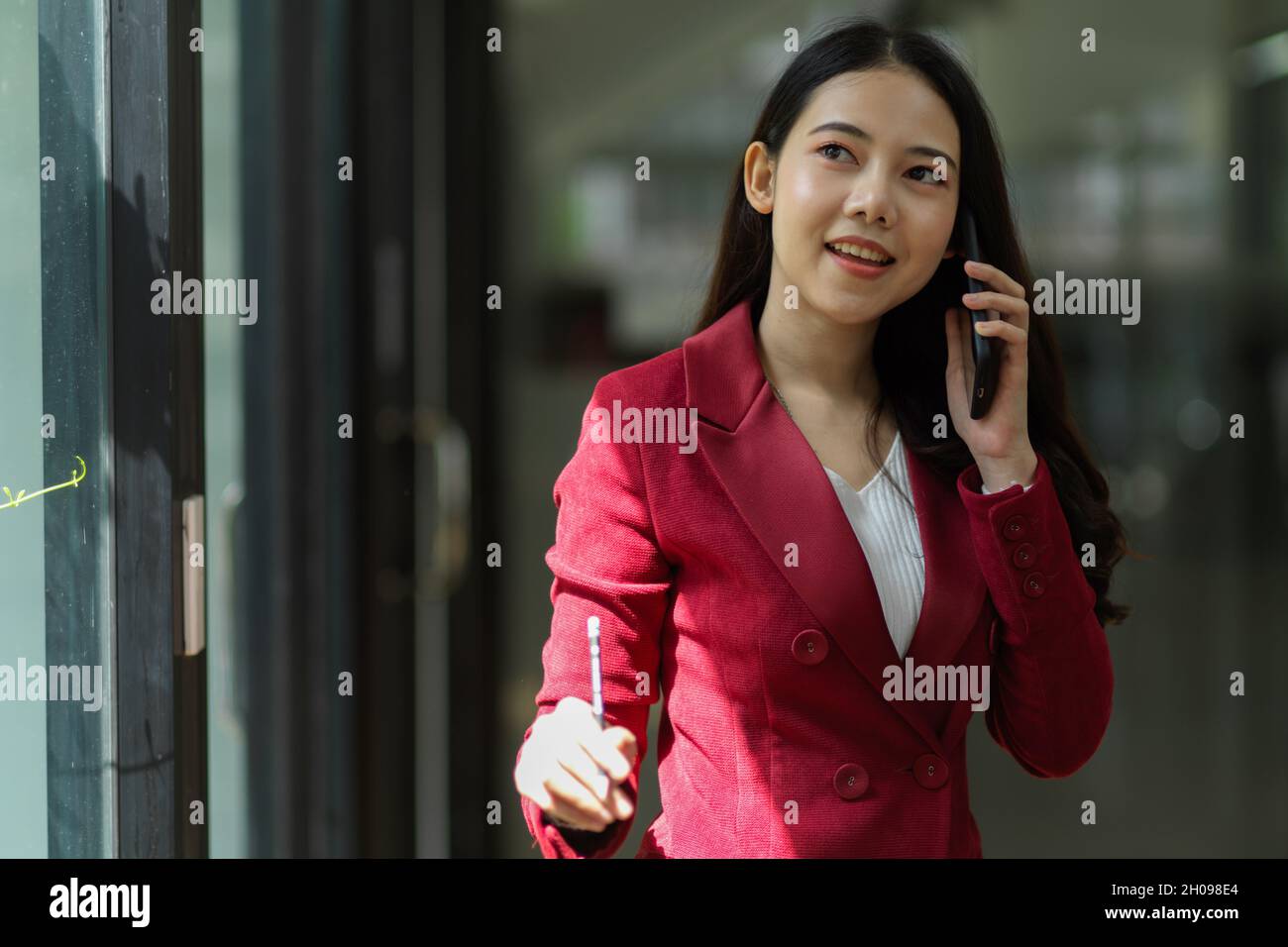 Female business professional making a phone call with business client ...