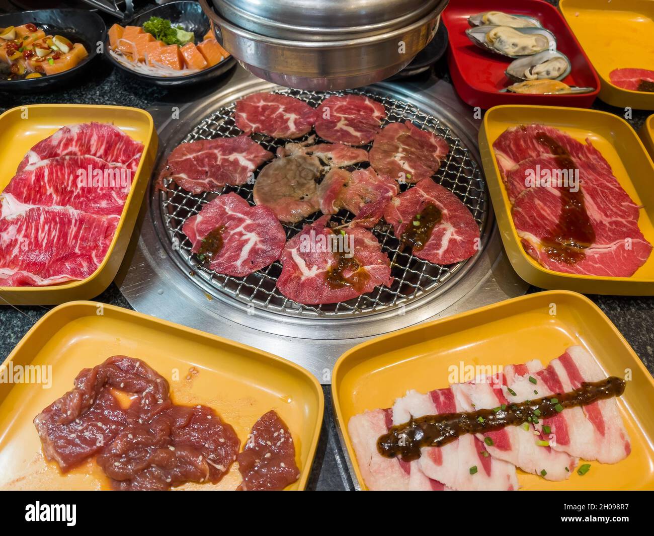 set of meat and pork grilled on charcoal in restaurant Stock Photo - Alamy