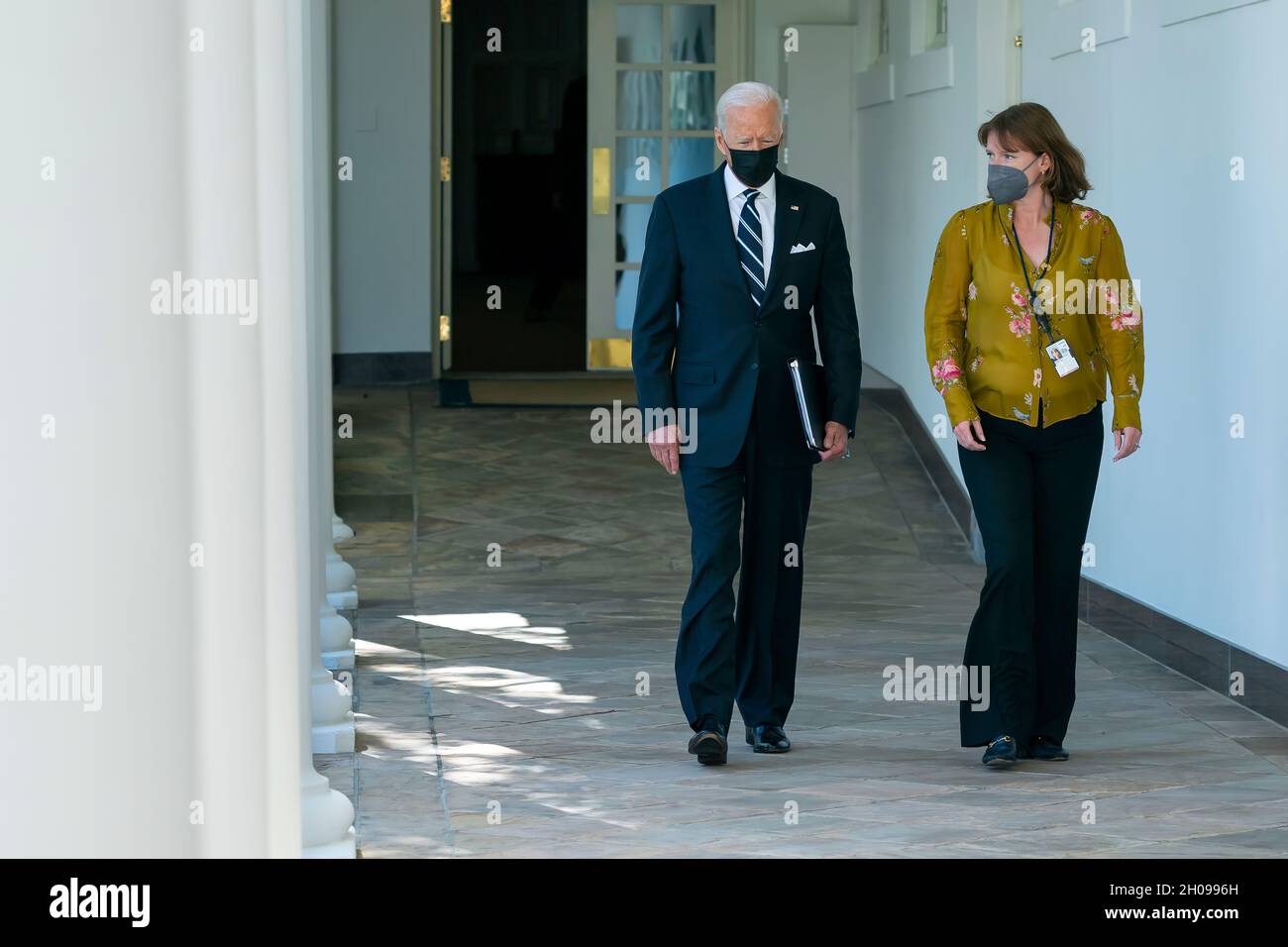 President Joe Biden and Communications Director Kate Bedingfield walk ...