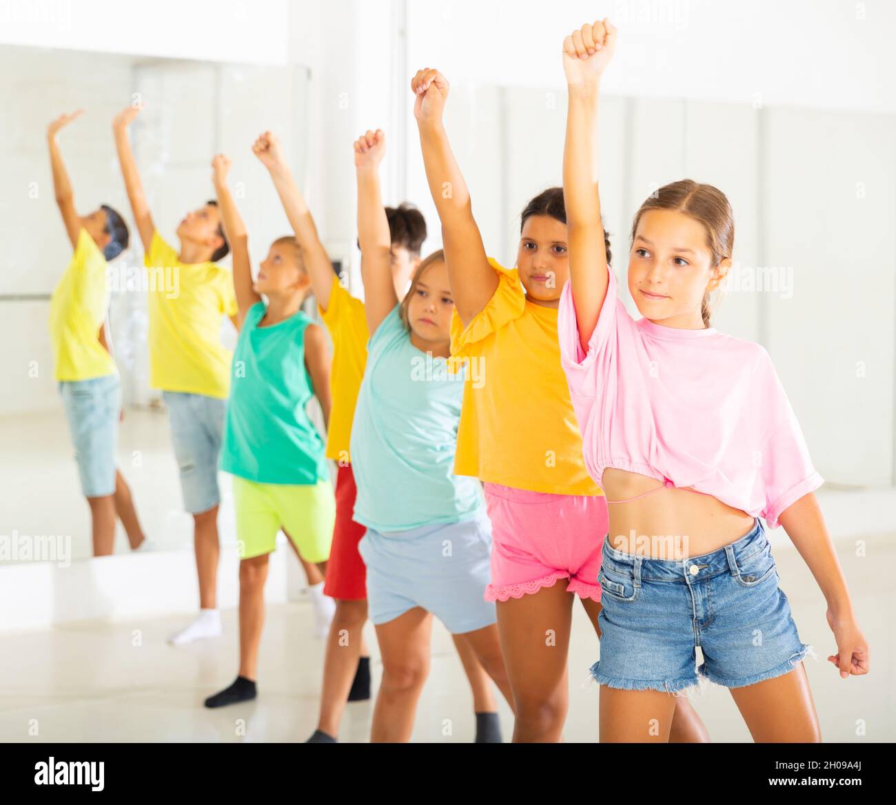 Children primary school age rehearsing movements of ballet dance in ...