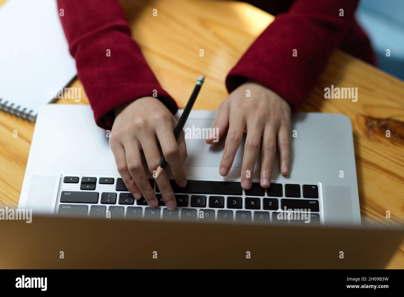 Closeup, Top view of business woman's hands typing on laptop keyboard ...