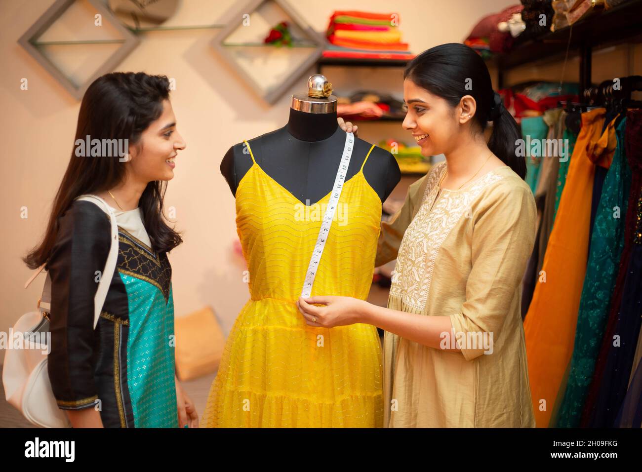Young happy indian woman,tailor seamstress,smiling fashion designer ...