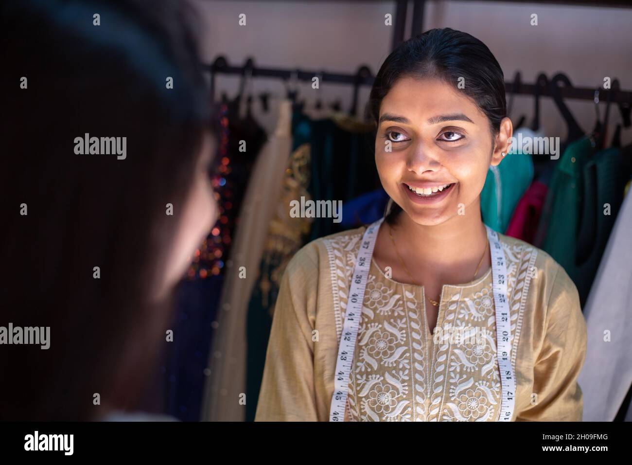 Young happy indian woman,tailor seamstress,smiling fashion designer ...