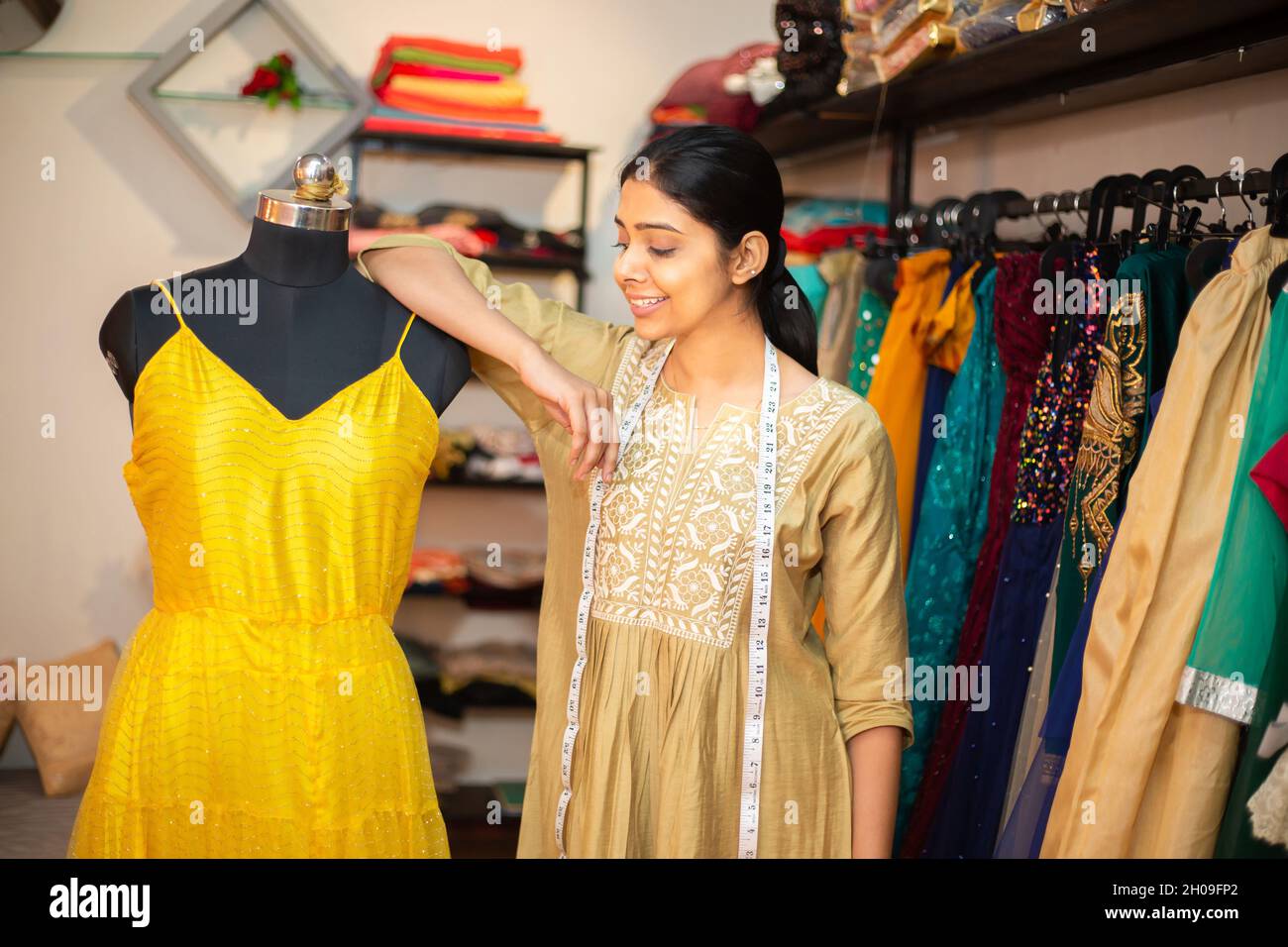 Young happy indian woman,tailor seamstress,smiling fashion designer ...
