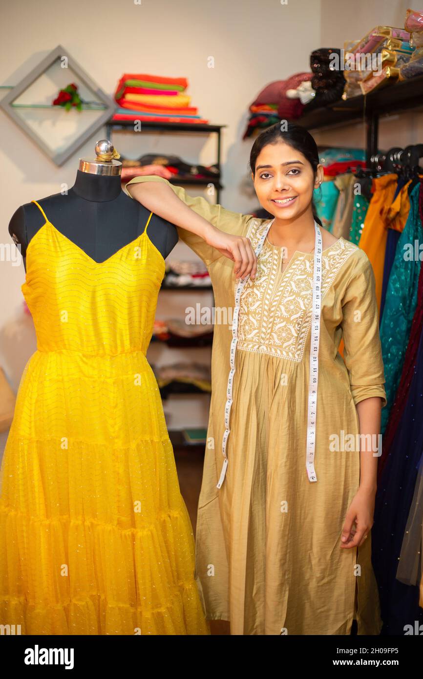 Portrait of Young happy indian woman,tailor,smiling fashion designer ...